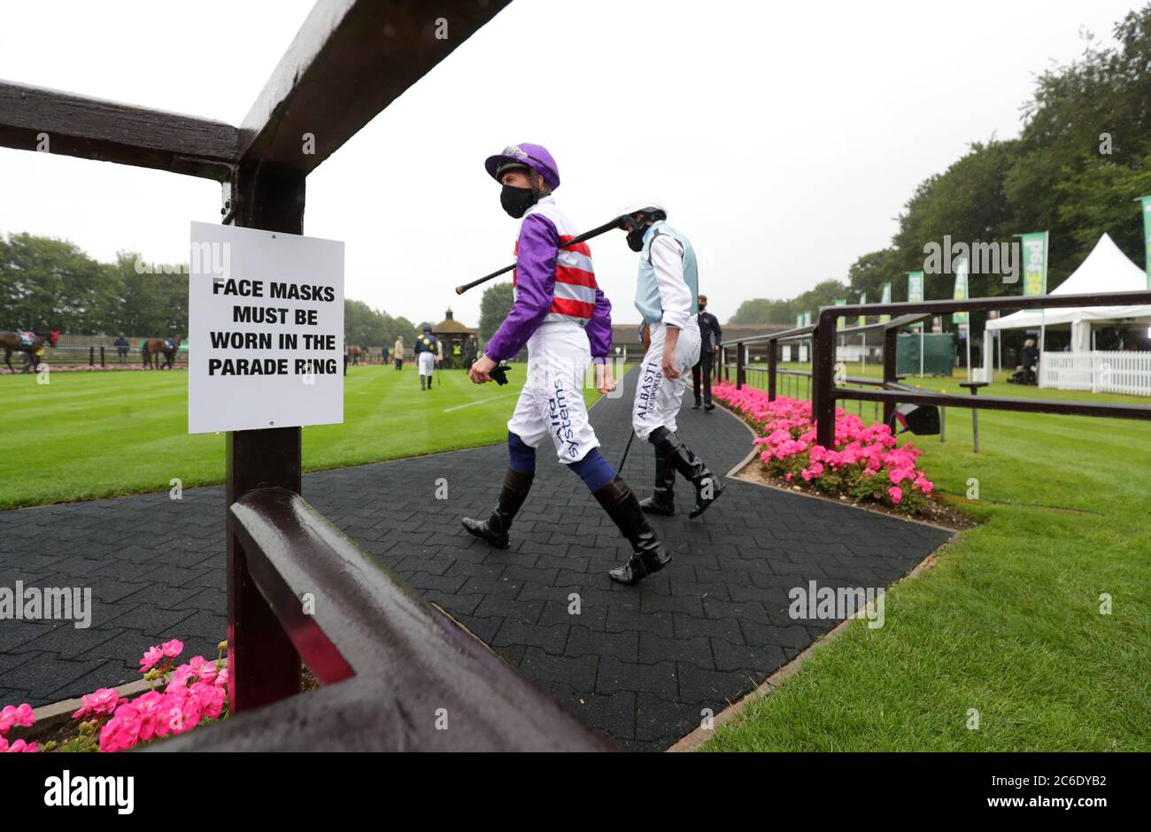Jockeys enter the parade ring during day one of The Moet and Chandon ...