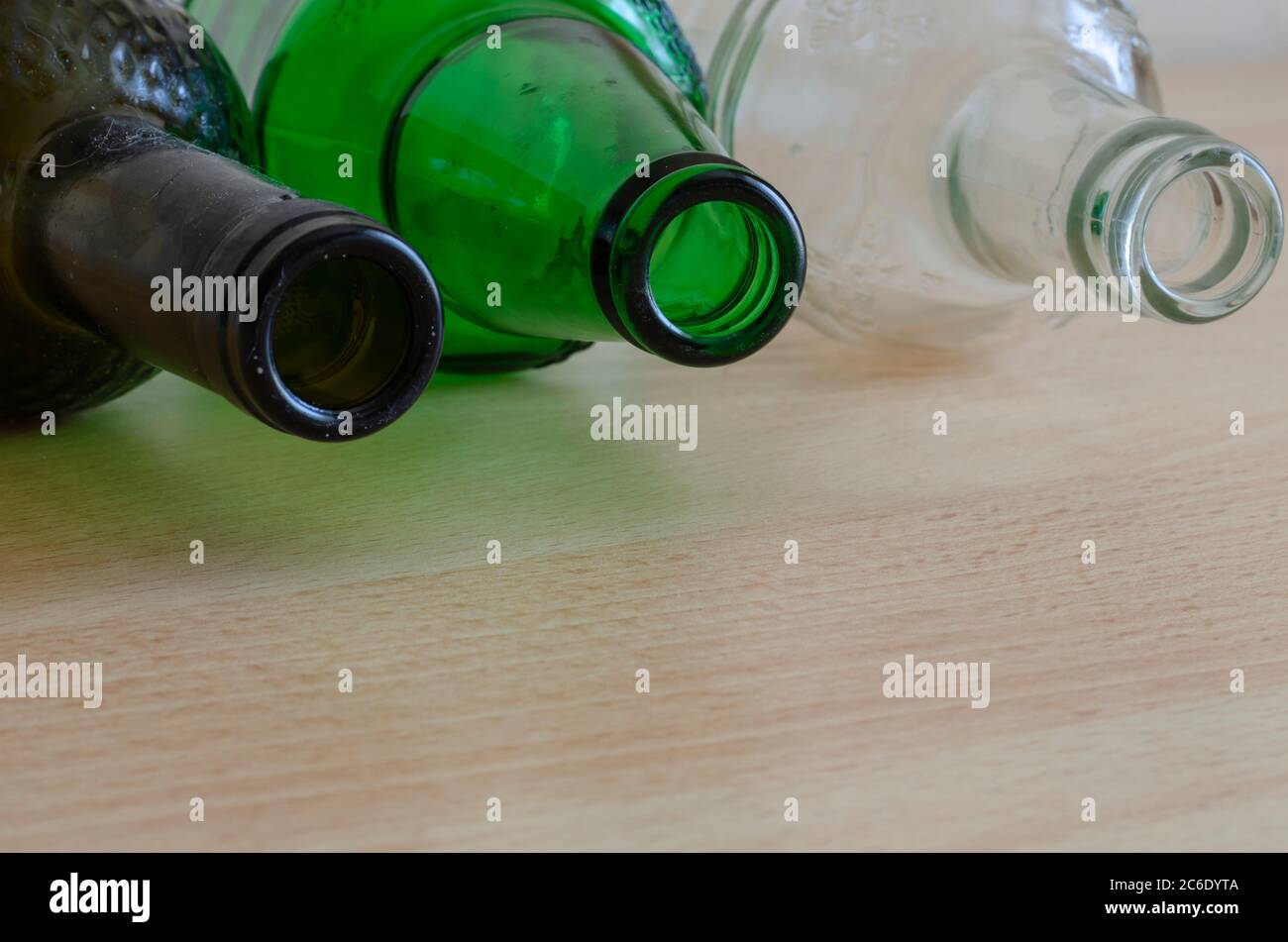 Close-up of three glass bottles with dust and dirt. Three empty beer ...