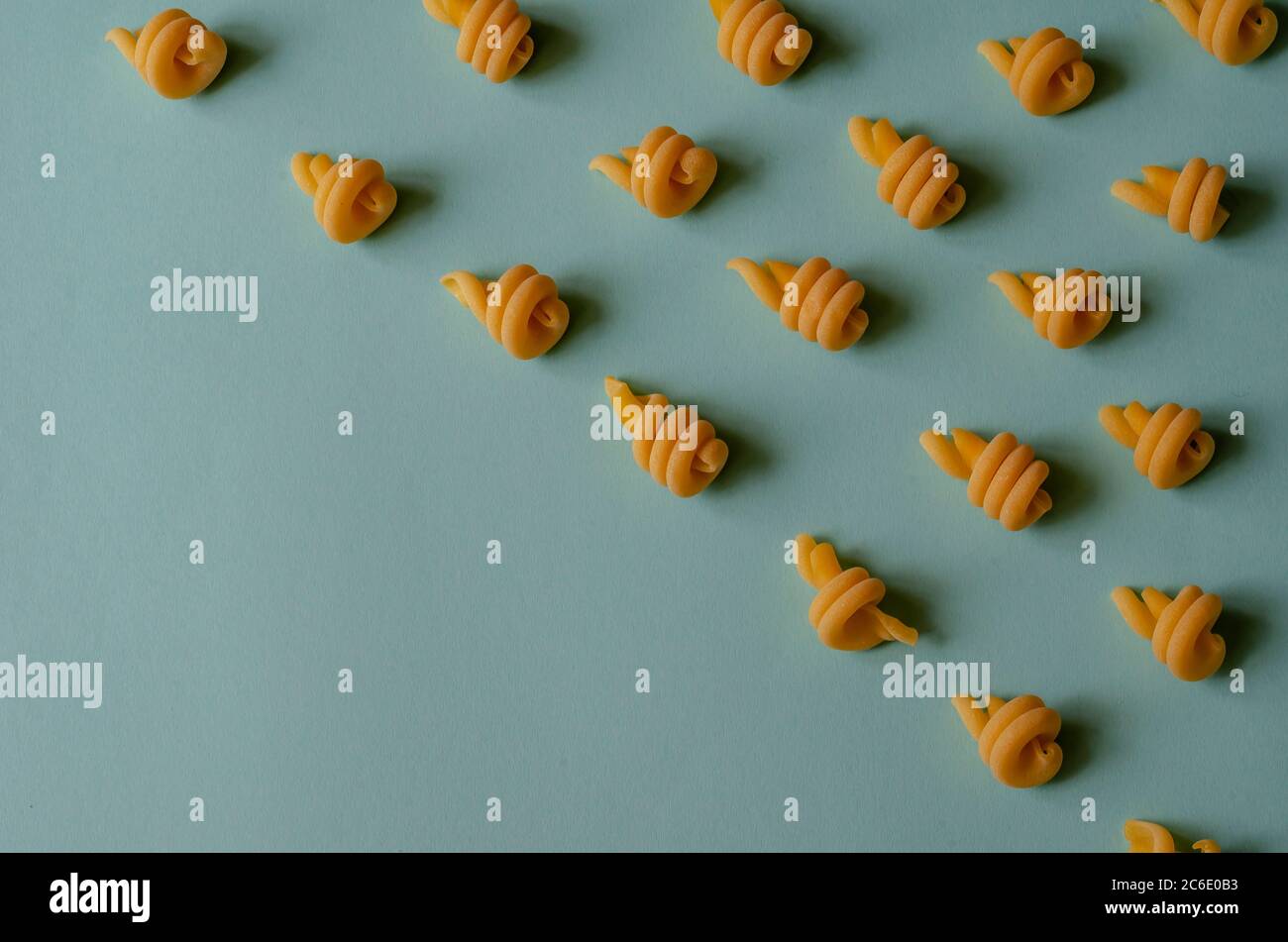 Creative background with insalatonde pasta on a light blue background ...