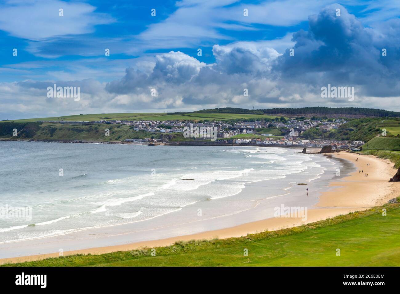 CULLEN BAY BEACH AND TOWN MORAY COAST SCOTLAND PEOPLE WALKING ON THE ...