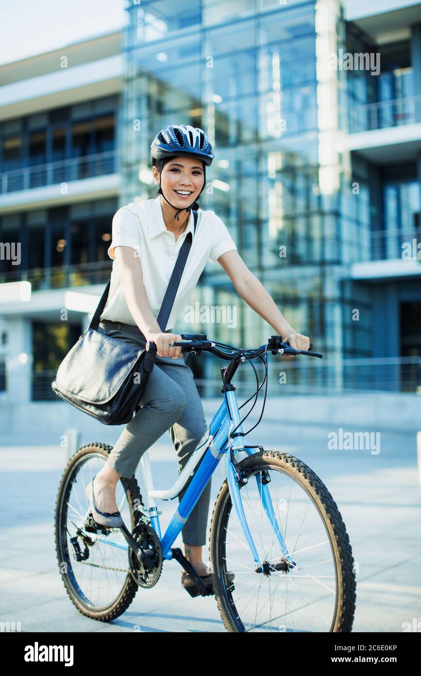 Asian business woman riding bike hi-res stock photography and images ...