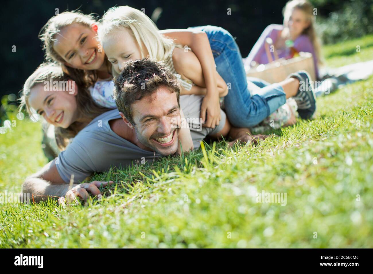 Father hugging daughters hi-res stock photography and images - Alamy
