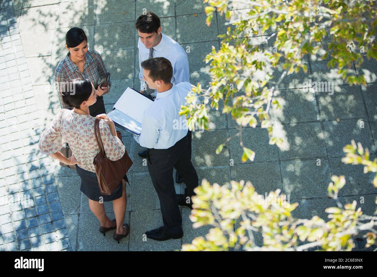 Business people talking outdoors Stock Photo - Alamy