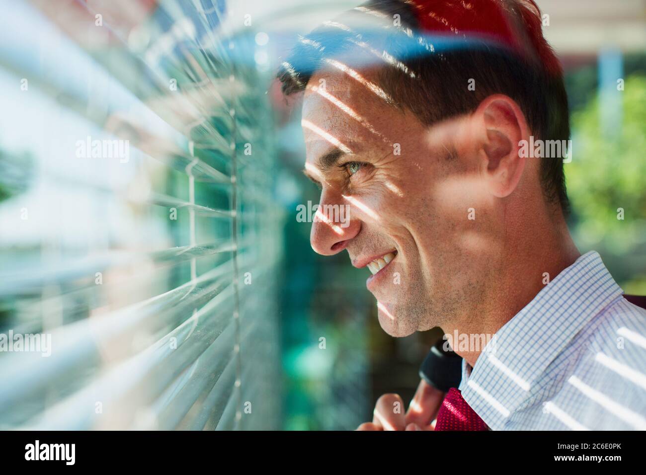 Man peeking out window hi-res stock photography and images - Alamy