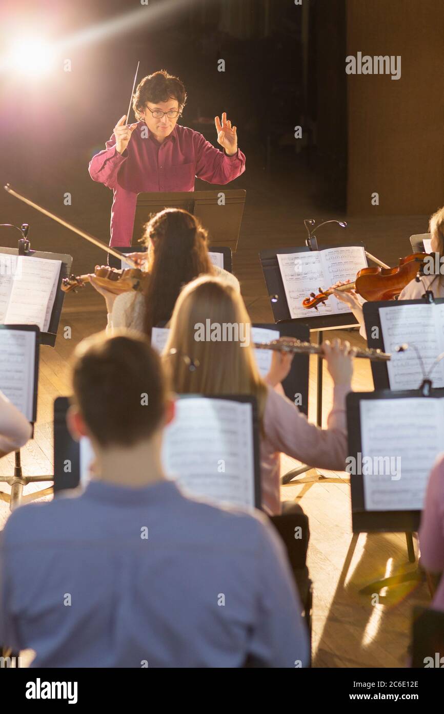 Conductor with raised baton hi-res stock photography and images - Alamy