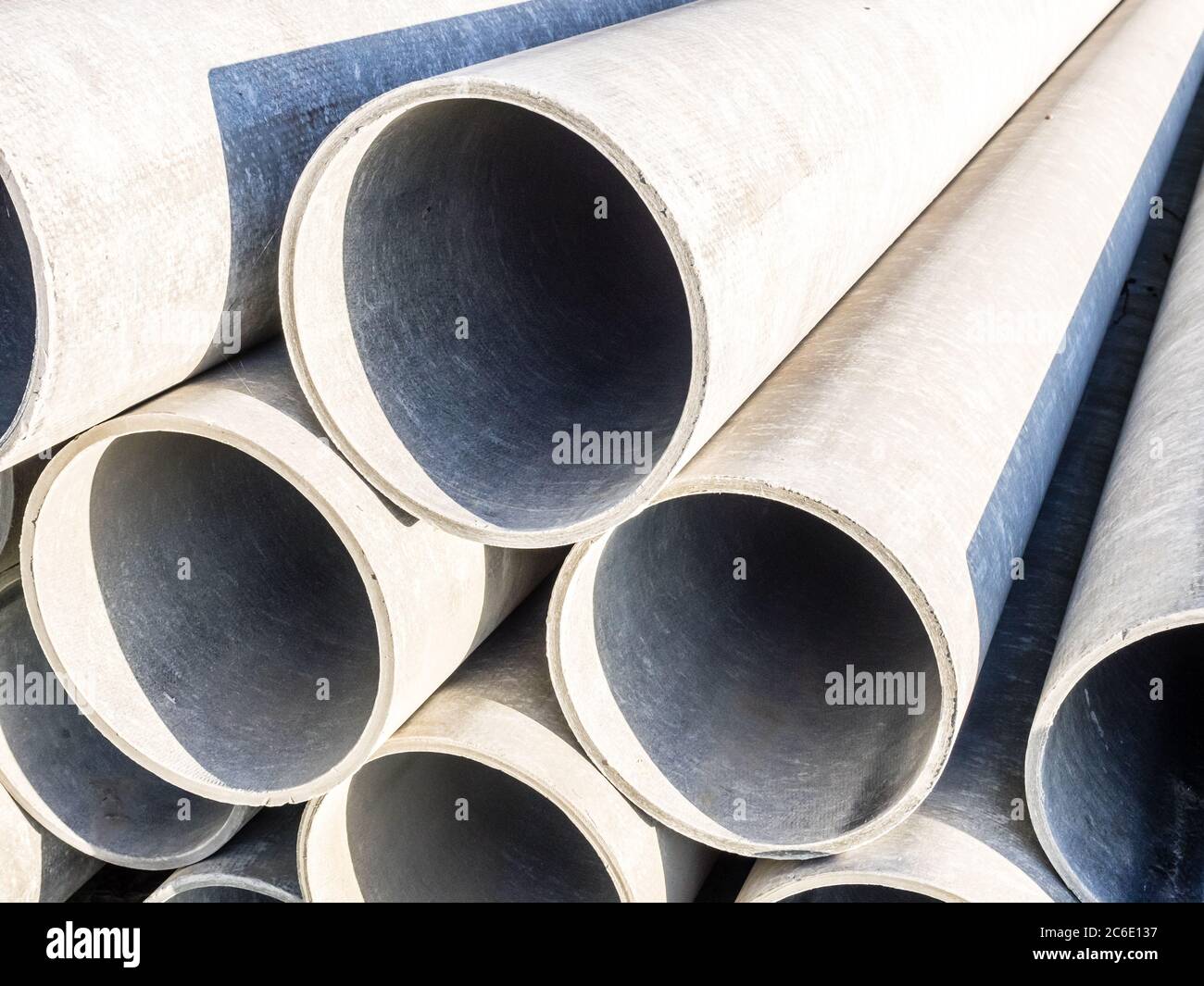 Close up image of pile grey steel pipes at the construction site ...
