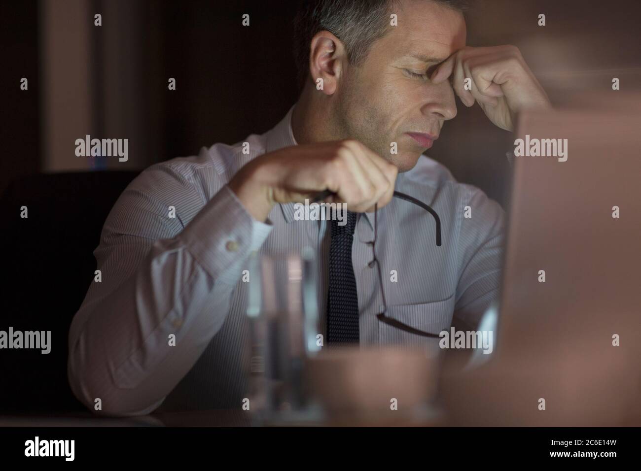 Head in hands sitting food and drink eyes closed tired hi-res stock ...