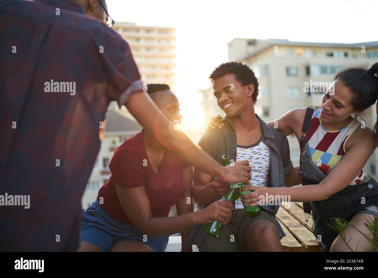 Four friends on balcony hi-res stock photography and images - Alamy