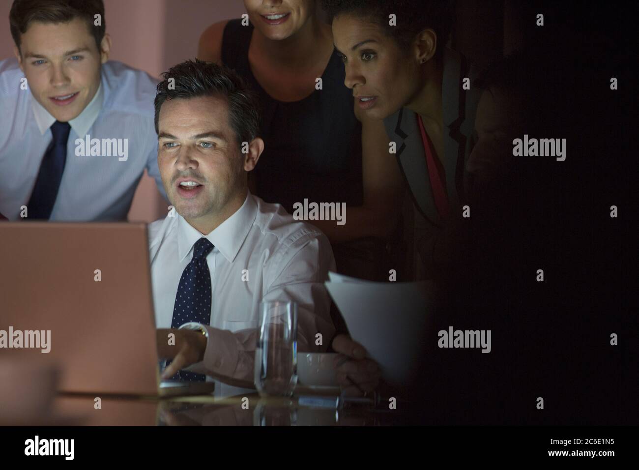 Business people working at laptop in conference room Stock Photo - Alamy