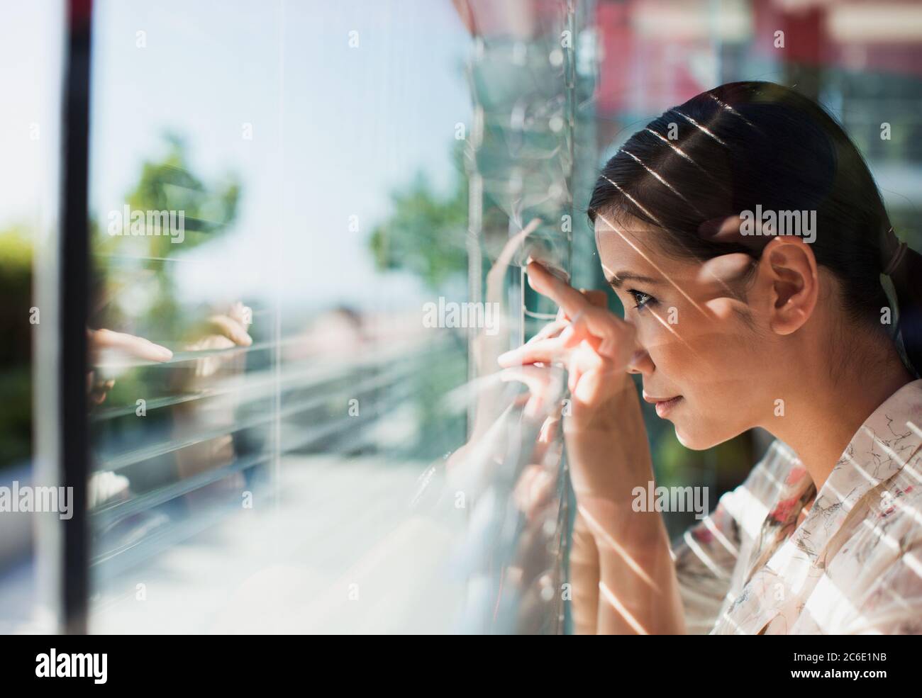 Peering out of window hi-res stock photography and images - Alamy