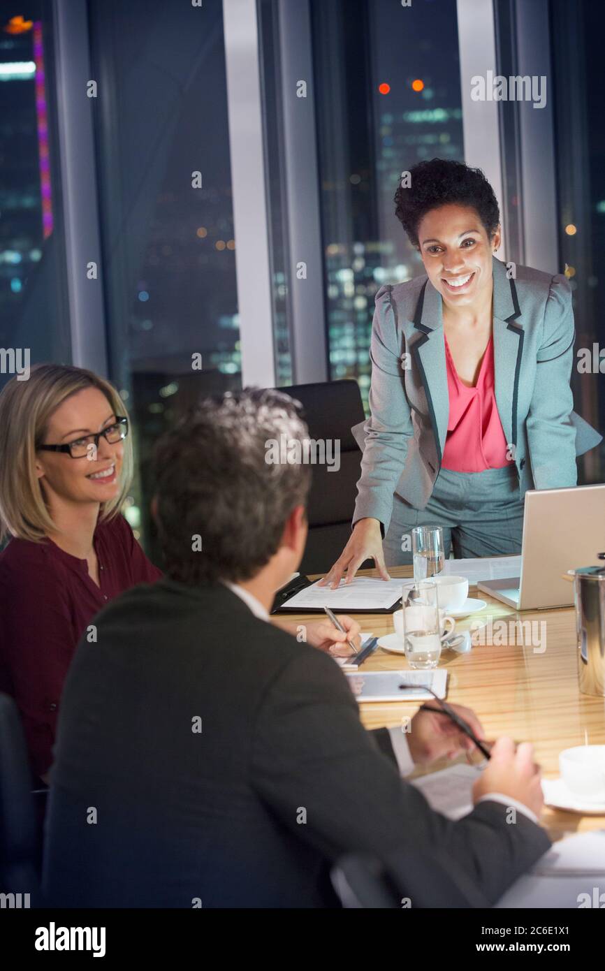 Business people meeting in conference room at night Stock Photo - Alamy
