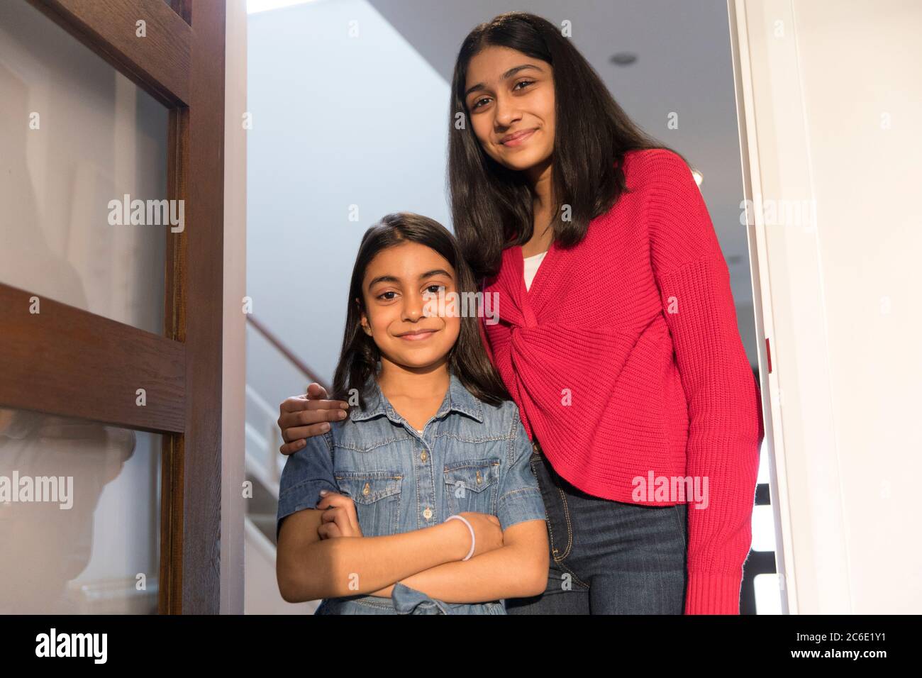 Portrait two happy sisters hugging hi-res stock photography and images ...