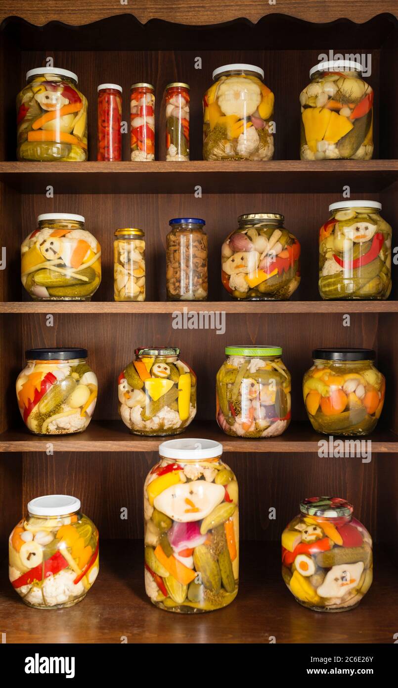 Home Canning of Summer Vegetables Stored on Wooden Shelves. Grandmother ...