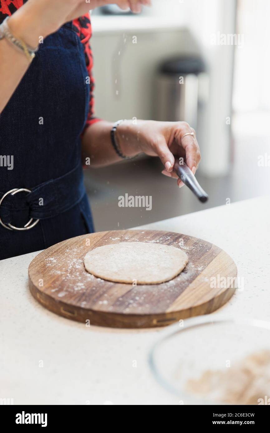 Woman making naan bread in kitchen Stock Photo - Alamy