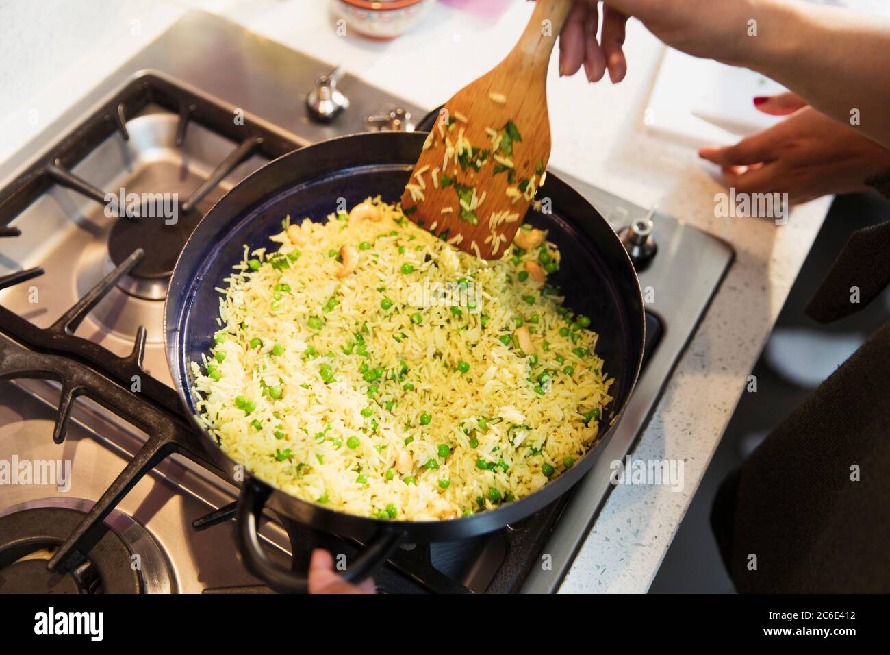 Indian woman cooking rice hi-res stock photography and images - Alamy