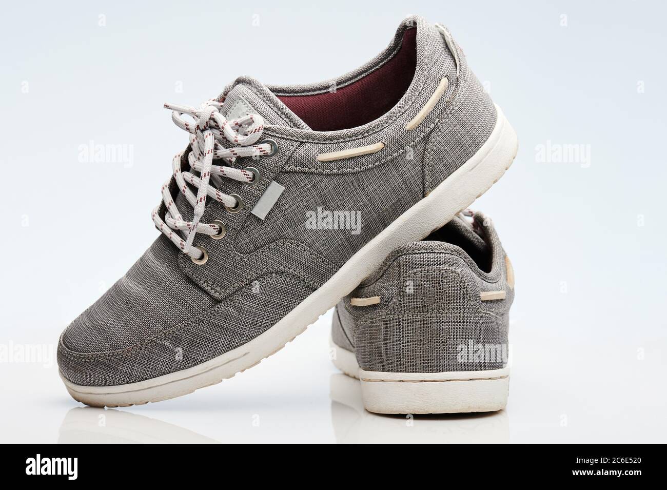 Pair of gray casual shoes isolated on white background Stock Photo - Alamy