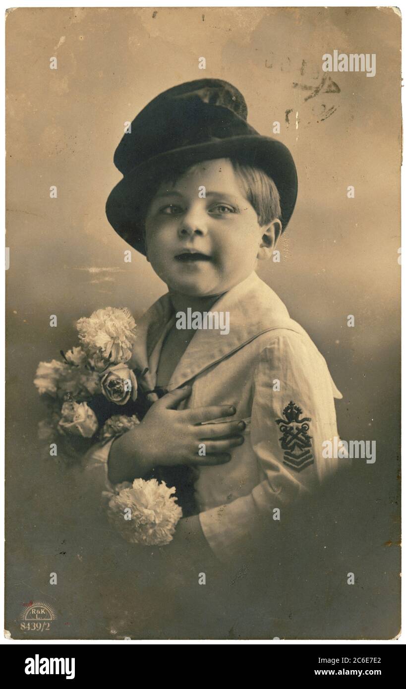 Boy with flowers in hat Cut Out Stock Images & Pictures - Alamy
