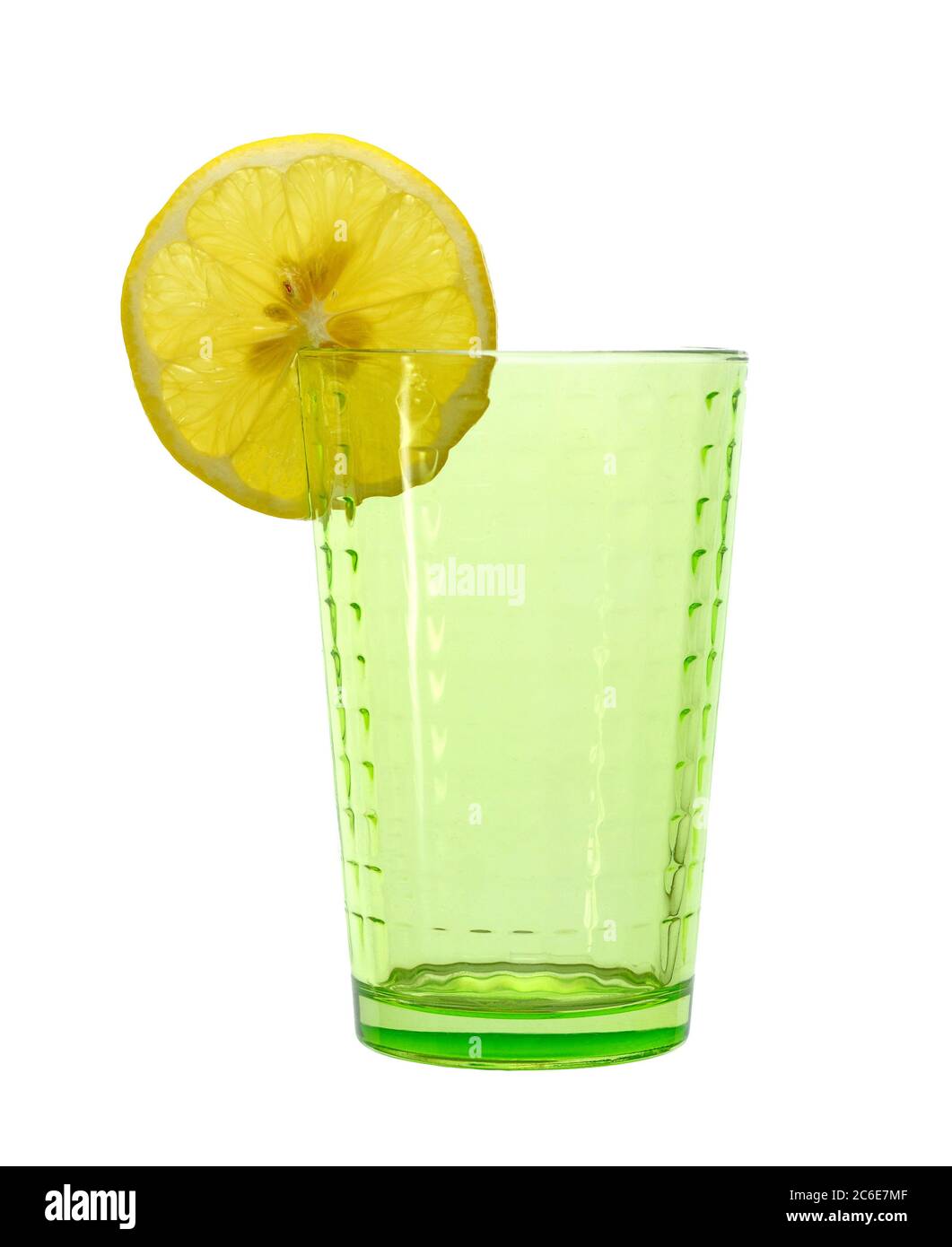 empty transparent green glass with lemon slice Stock Photo - Alamy