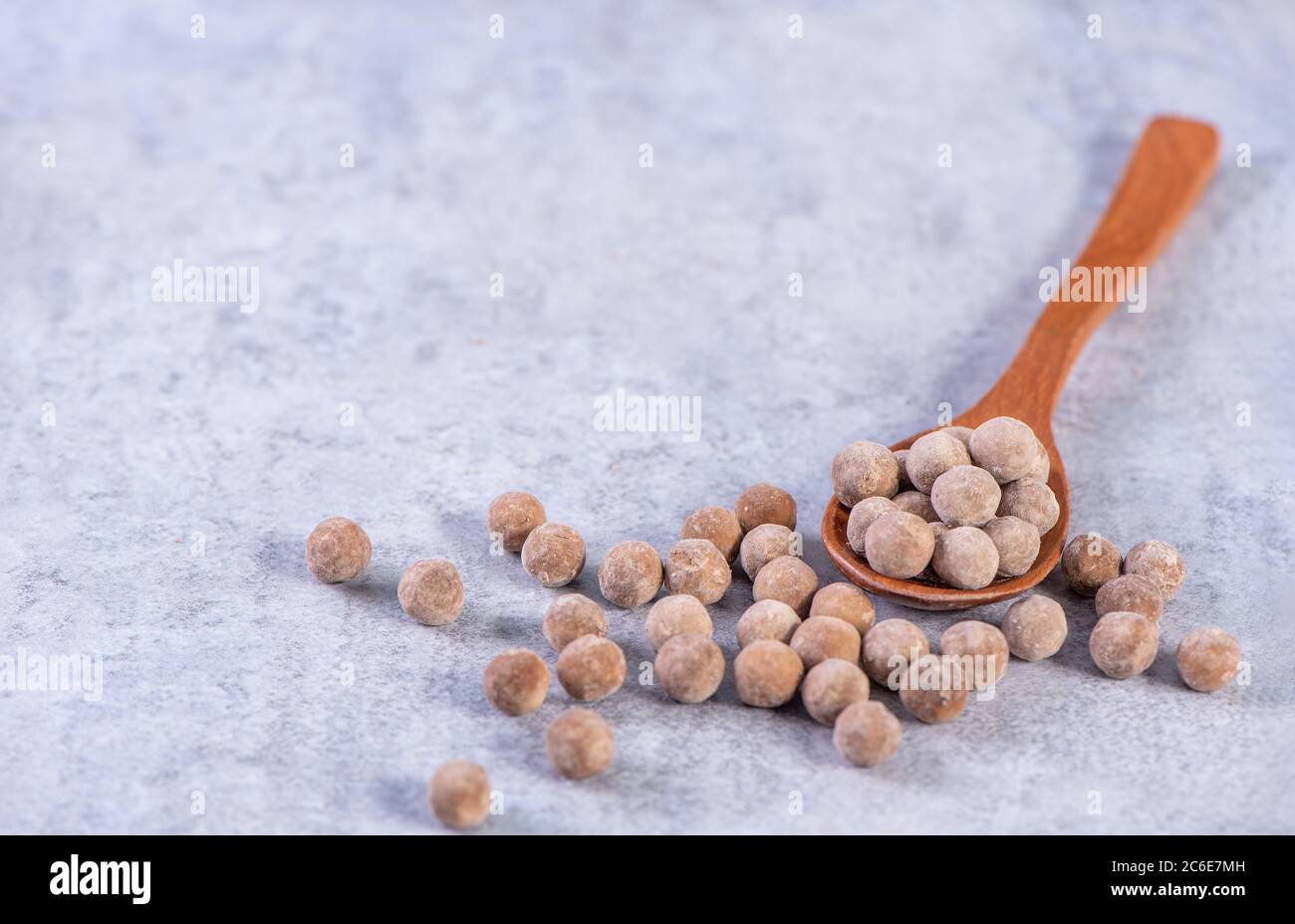 Dry raw brown tapioca pearls isolated on gray cement concrete ...