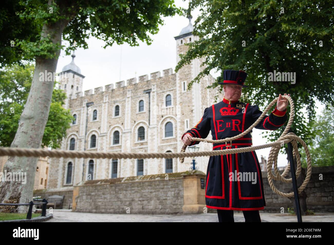 Chief Yeoman Warder Peter McGowran sets out ropes for a one-way system ...
