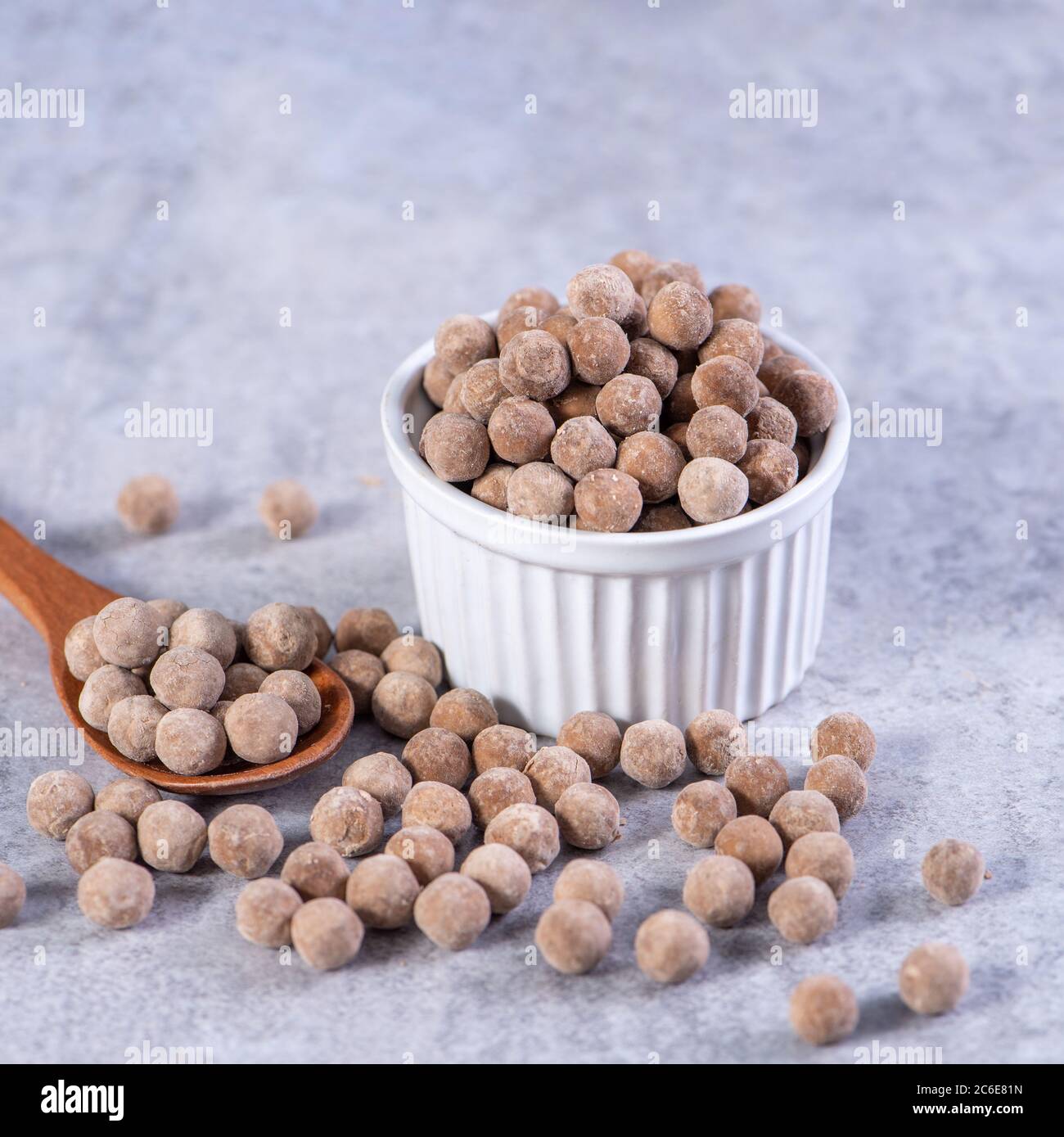 Dry raw brown tapioca pearls isolated on gray cement concrete ...