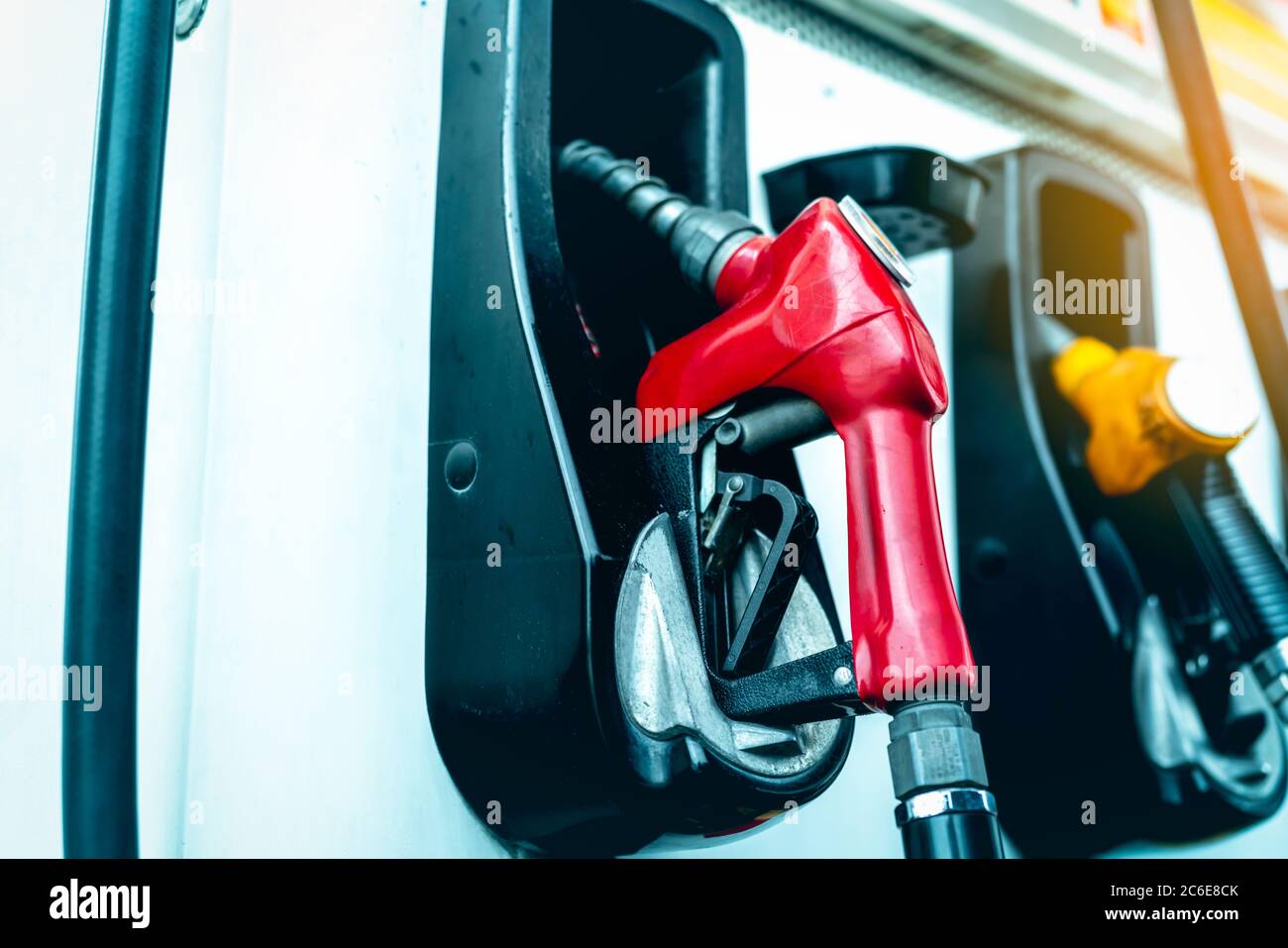 Petrol pump filling fuel nozzle in gas station. Fuel dispenser machine ...