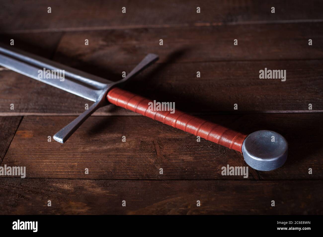 Old sword medieval weapon blade knight equipment wooden background ...