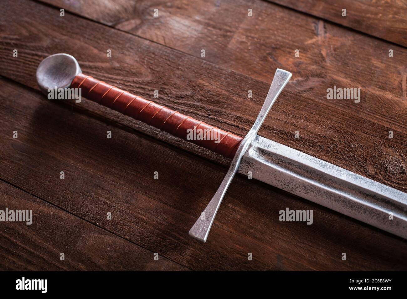 Old sword medieval weapon blade knight equipment wooden background ...
