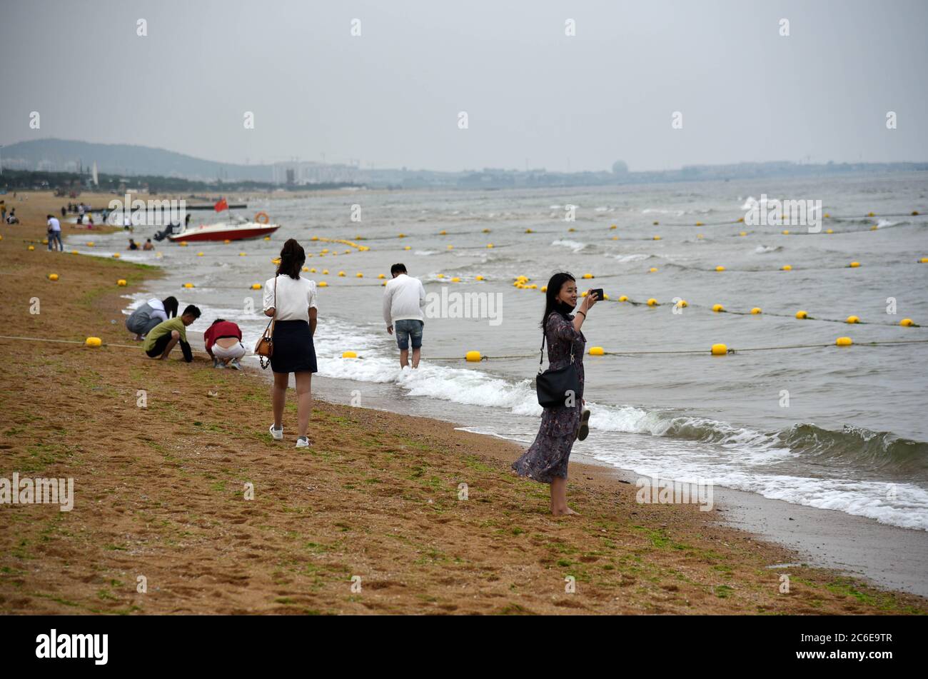 Rizhao. 9th July, 2020. People enjoy their time on a beach in Rizhao of ...