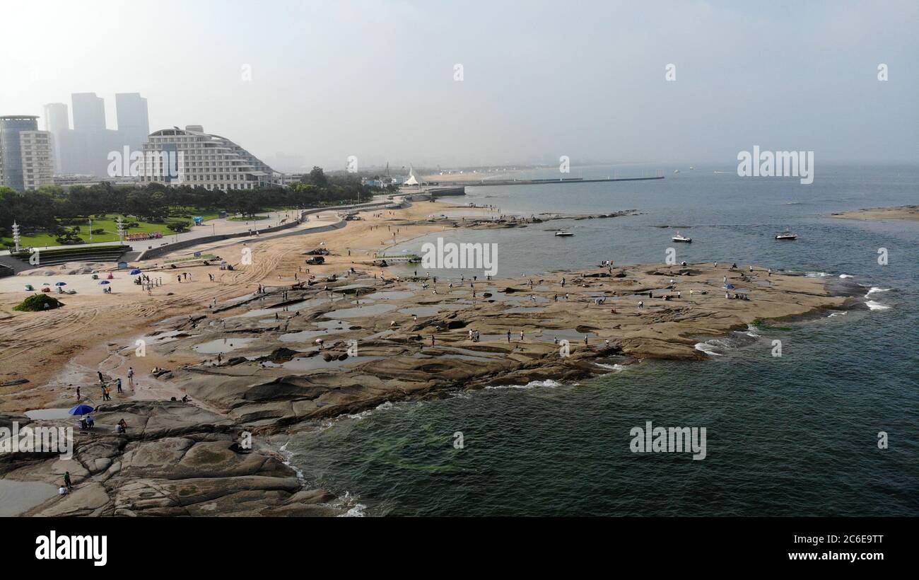 Rizhao. 8th July, 2020. Aerial photo shows people enjoying their time ...
