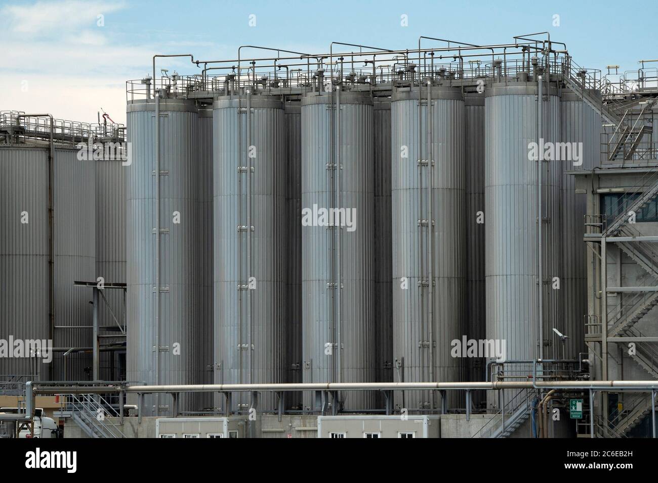 metallic silo on light blue sky background Stock Photo - Alamy