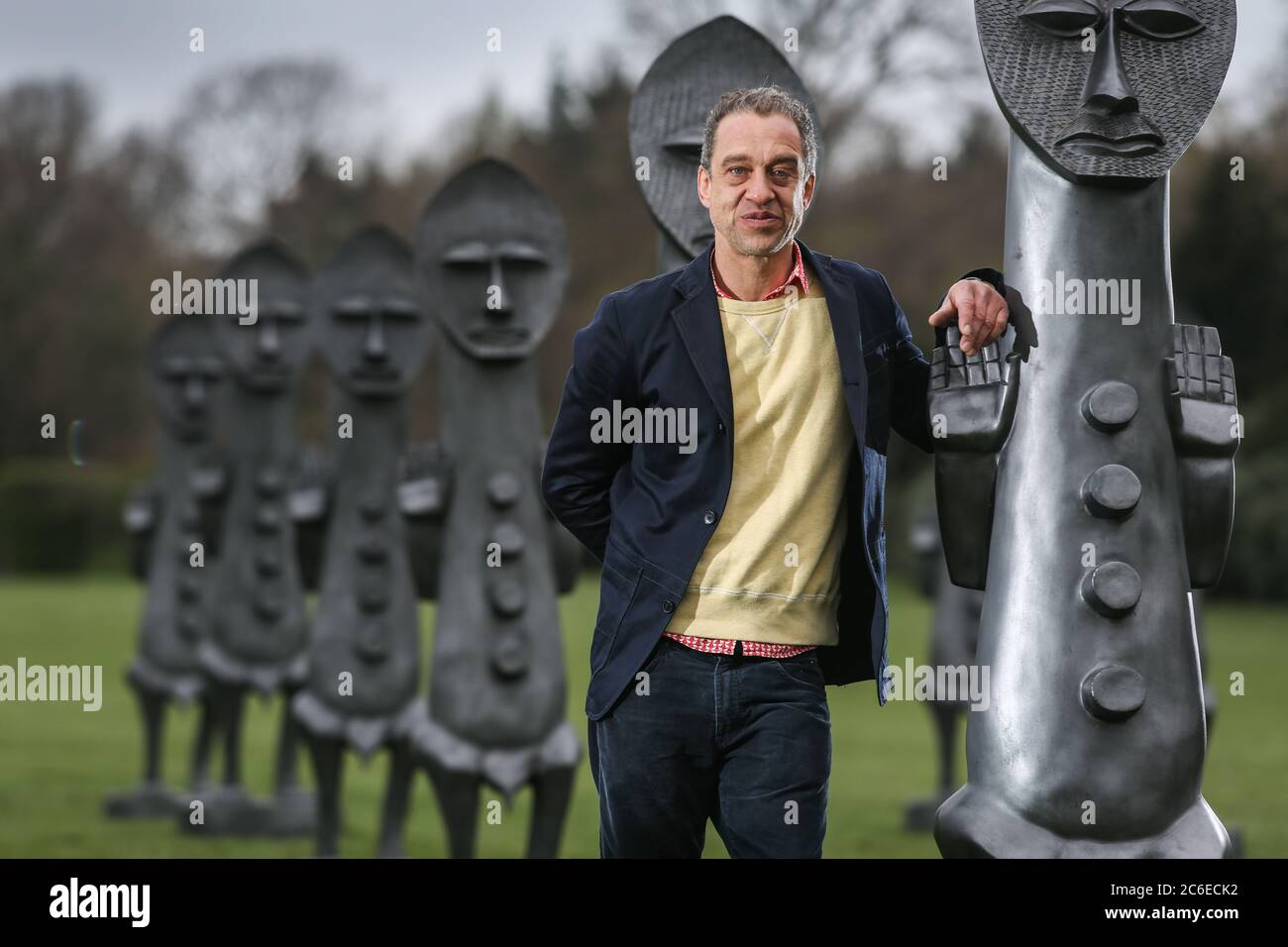 Artist Zak Ove in the middle of his 80 identical graphite figures at ...