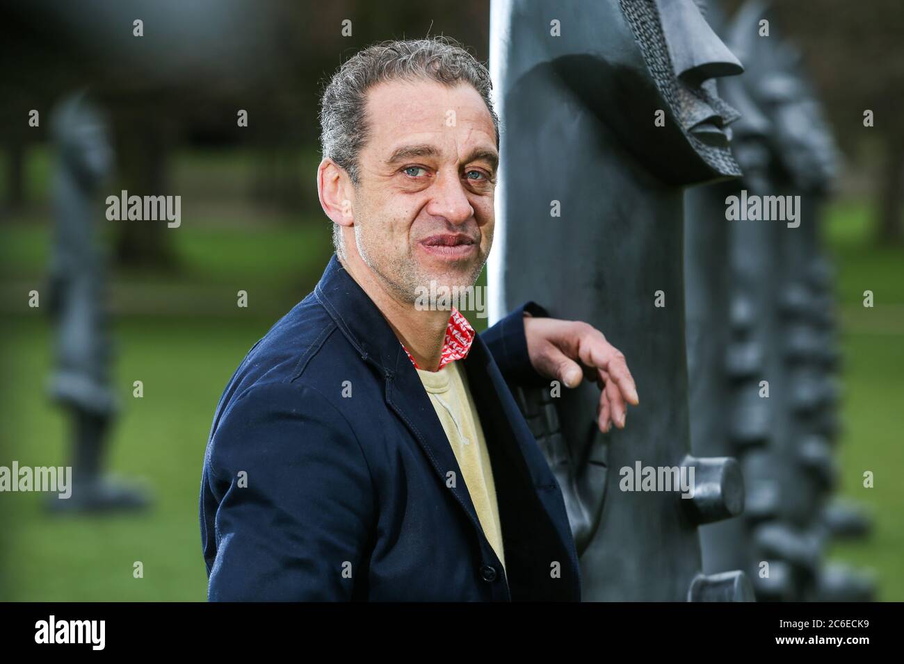Artist Zak Ove in the middle of his 80 identical graphite figures at ...