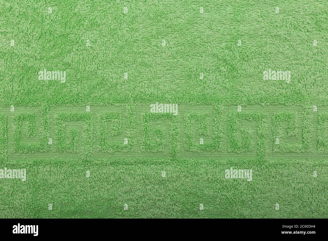Terry towel, texture, textile background close up. Terry green towel ...