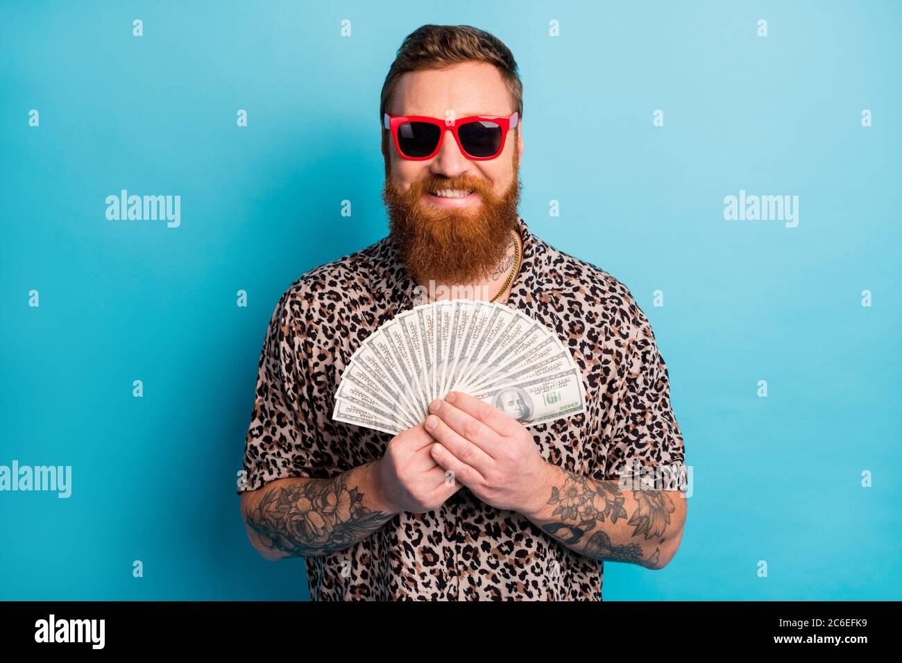 Photo of cool macho guy traveler holding fan of usa bucks excited good ...