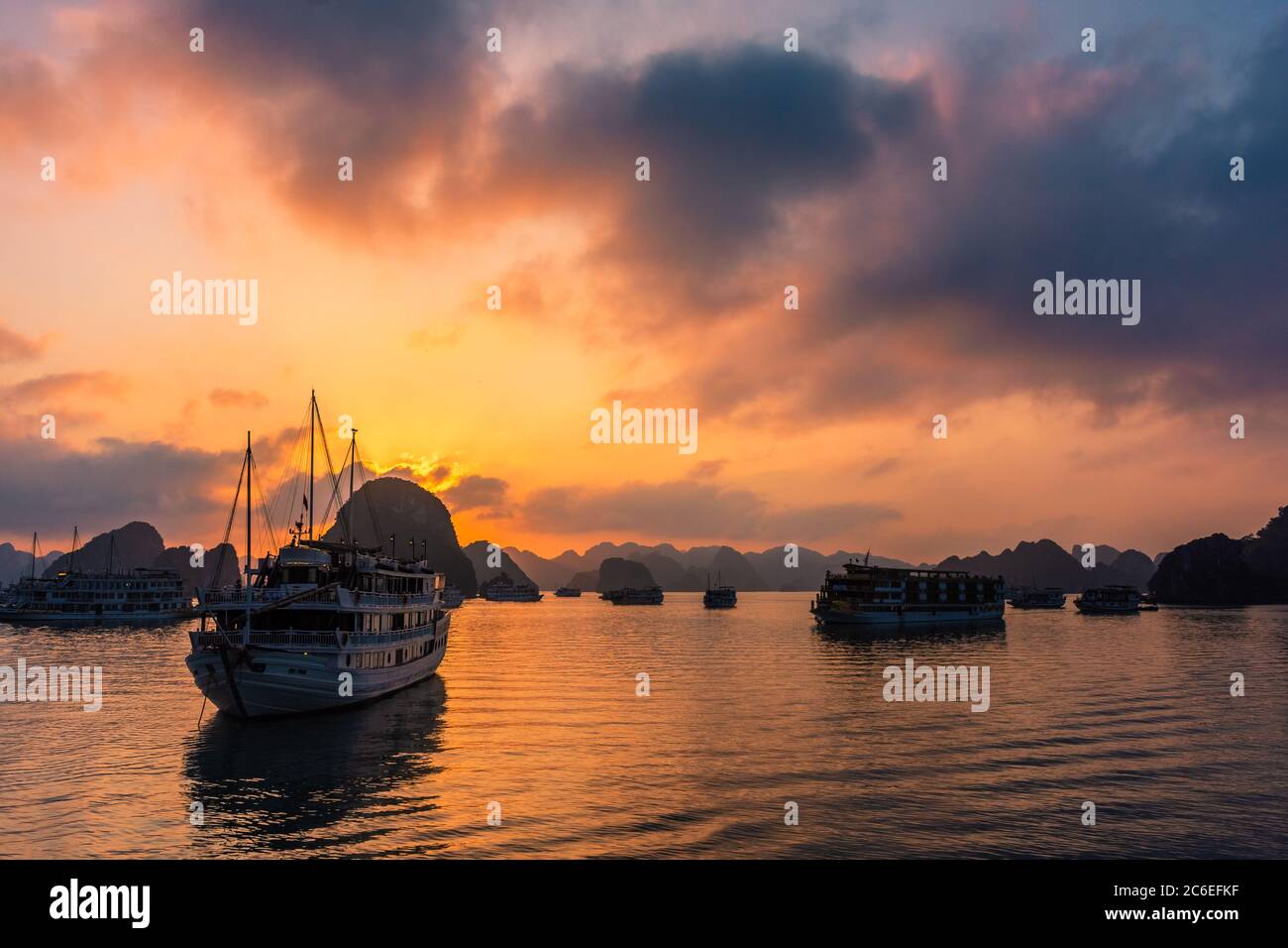 Amazing sunset over Ha Long Bay, Vietnam Stock Photo - Alamy
