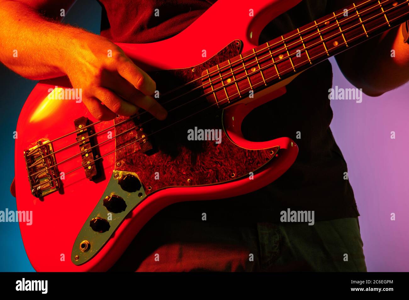 Close up. Young inspired and expressive musician, guitarist performing ...