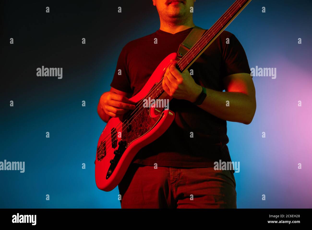 Close up. Young inspired and expressive musician, guitarist performing ...