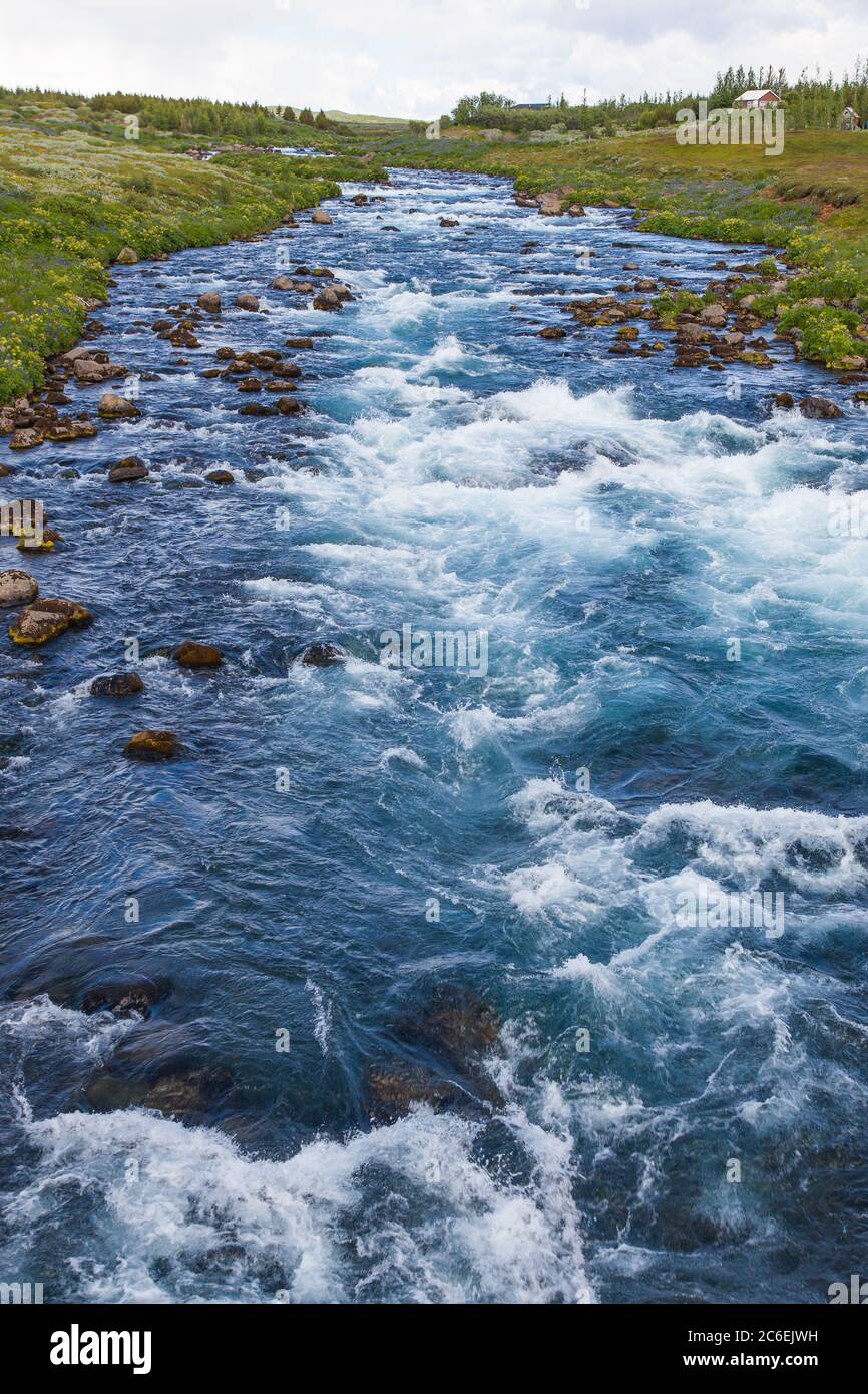 Icelandic landscape with blue water stream Stock Photo - Alamy
