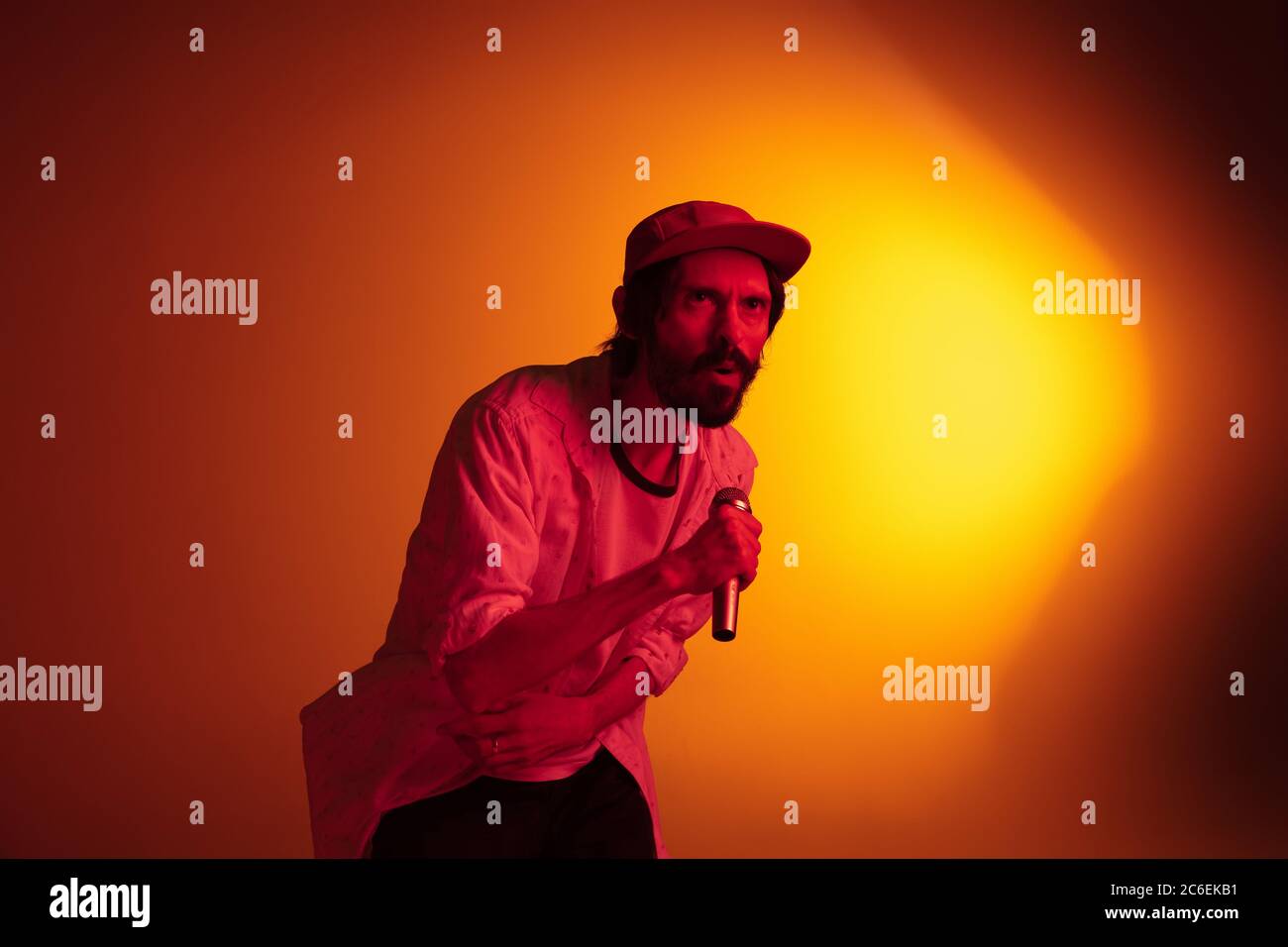 Party time. Young inspired and expressive musician, singer performing ...