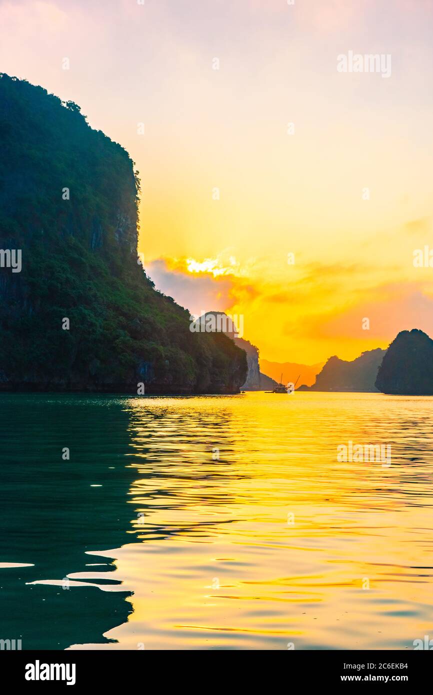 Amazing sunset over Ha Long Bay, Vietnam Stock Photo - Alamy