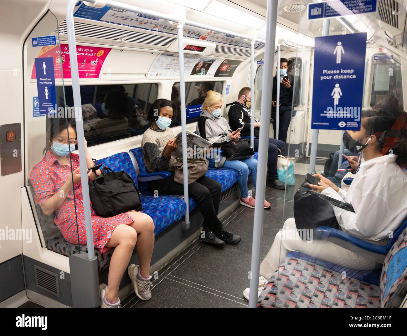 Commuters wearing face masks on the London Underground . Jubilee line ...