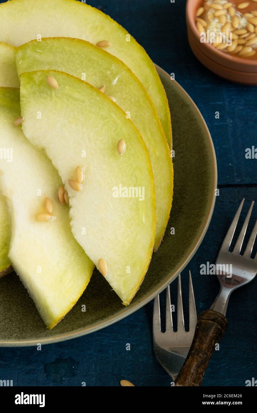 Refreshing summer food - sliced raw melon, ready to eat Stock Photo - Alamy