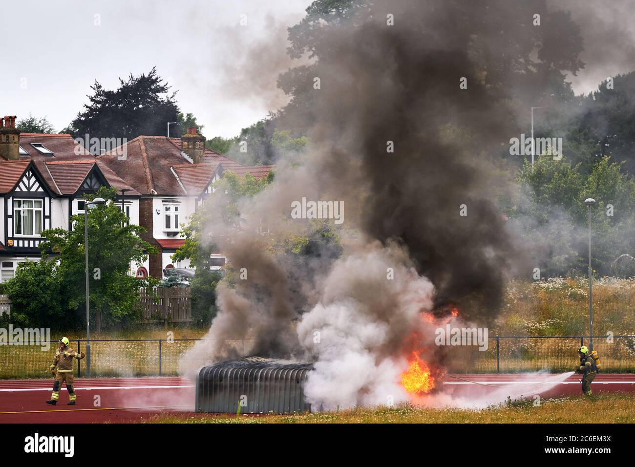 Firefighters put out a fire in a storage hut on the Osterley sports and ...
