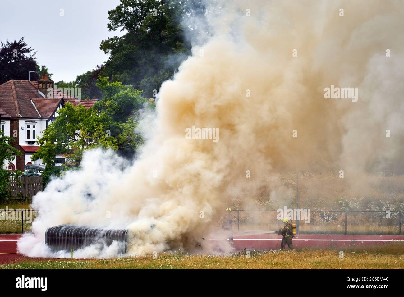 Firefighters put out a fire in a storage hut on the Osterley sports and ...