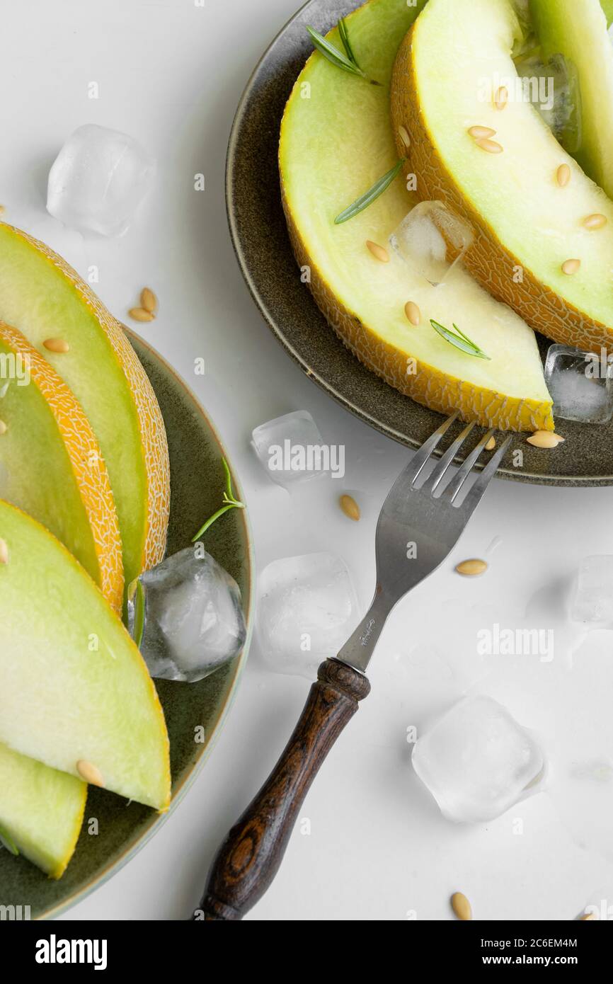Refreshing summer food - sliced raw melon, ready to eat Stock Photo - Alamy