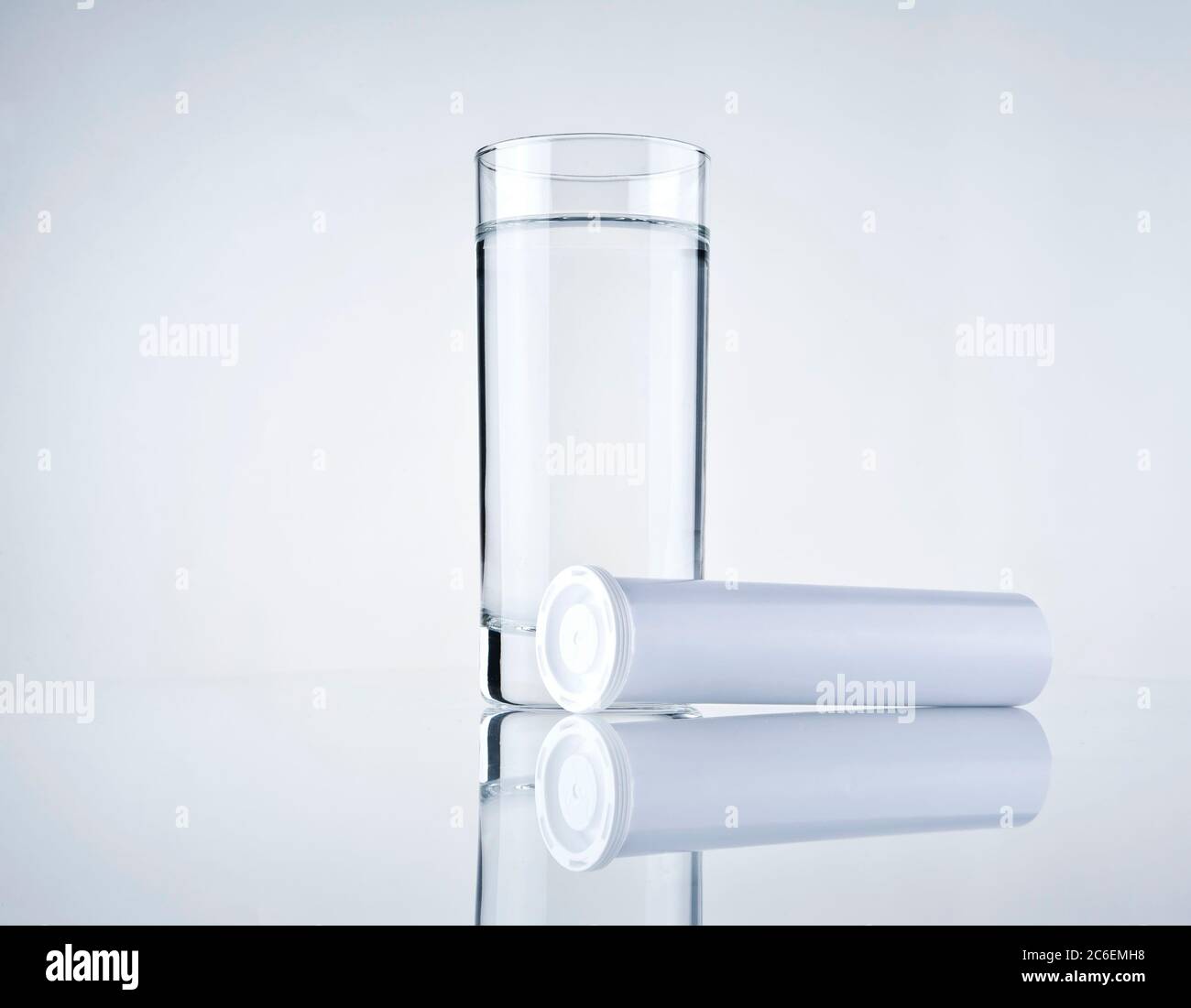 glass water and blank medicine container Stock Photo - Alamy