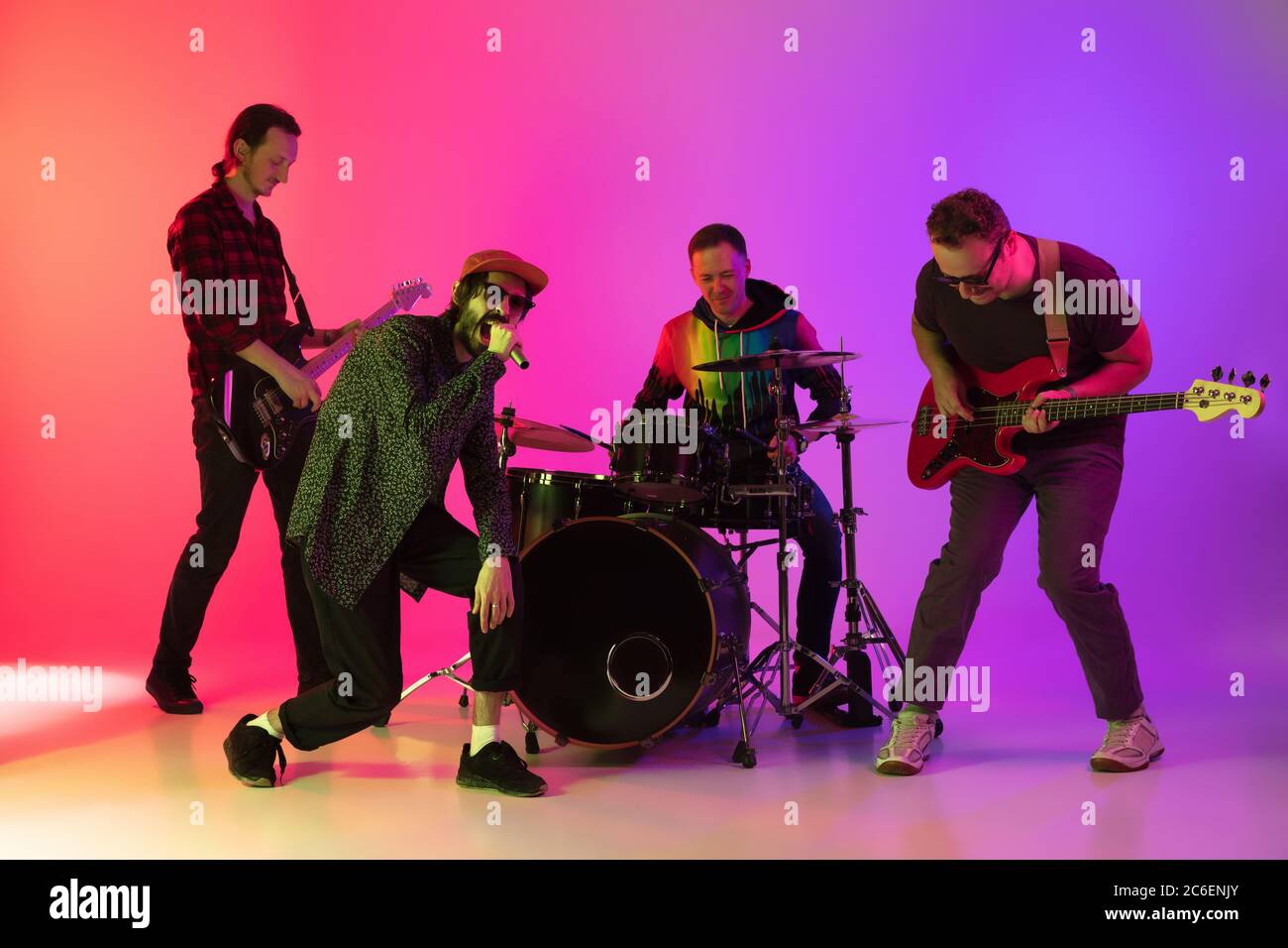 Motion. Young inspired and expressive music band performing on gradient ...