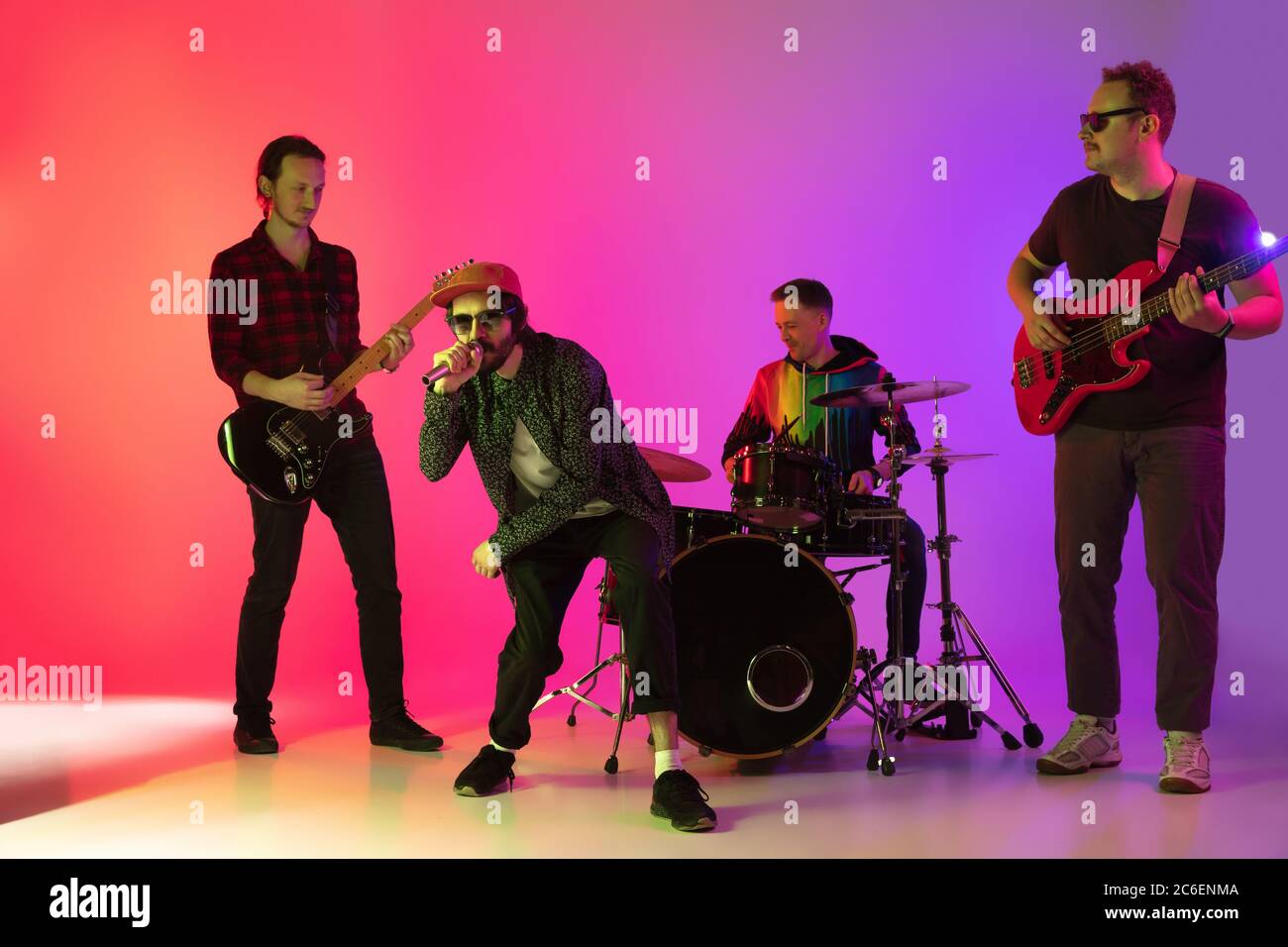 Motion. Young inspired and expressive music band performing on gradient ...