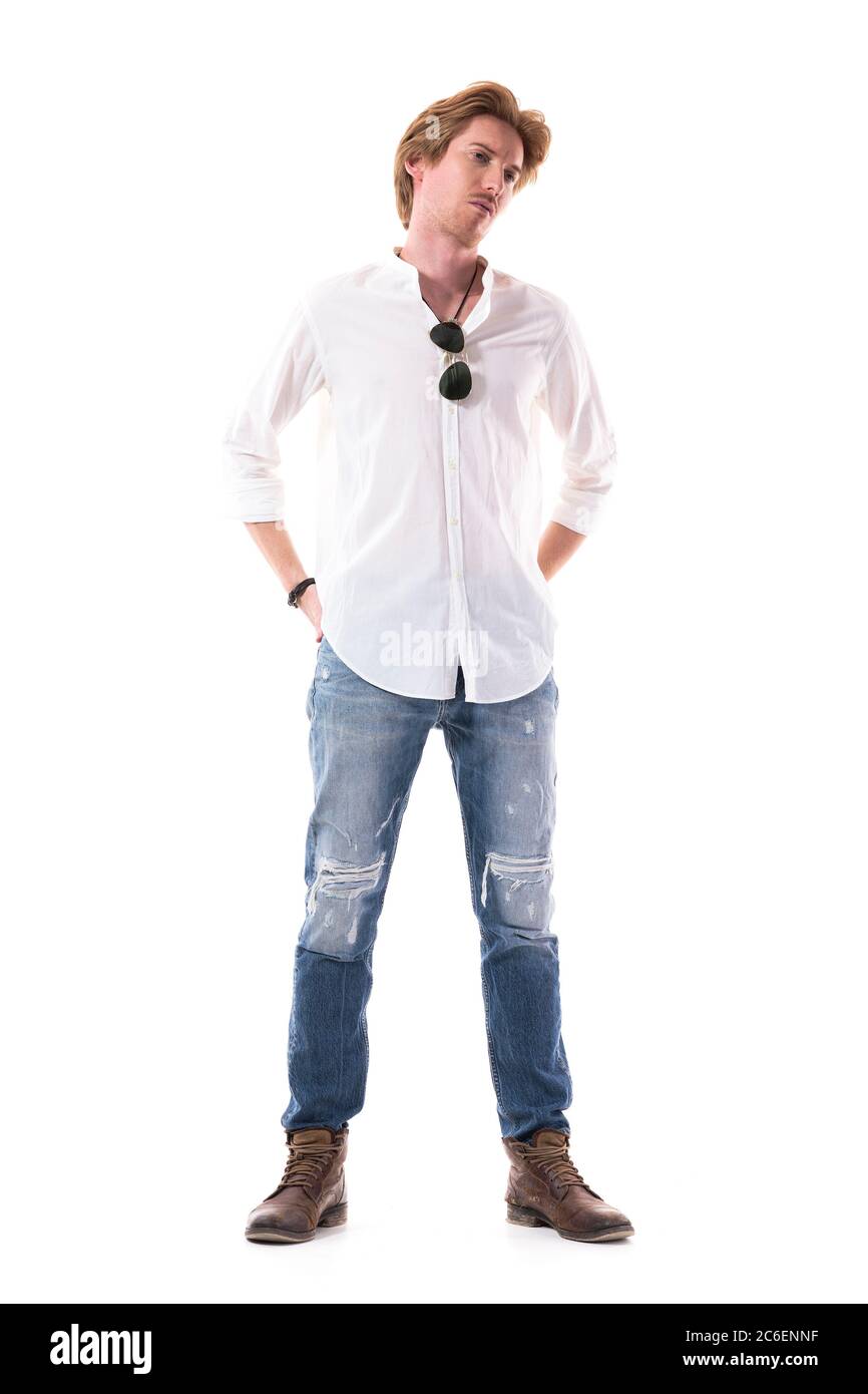 Displeased young handsome stylish man looking away watching serious ...